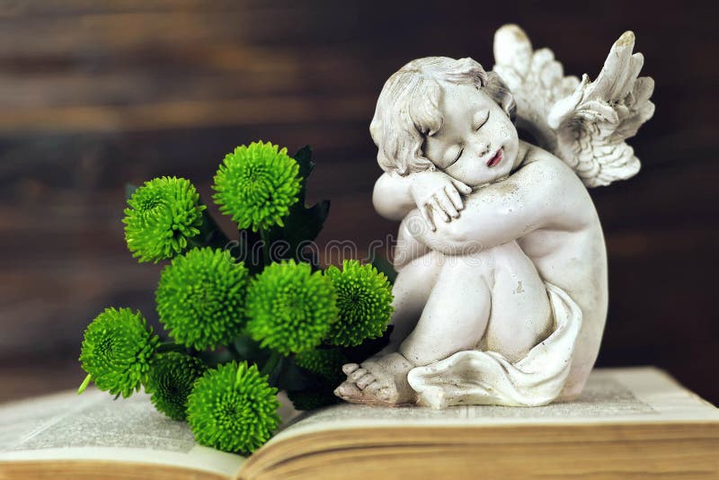 Sleeping Cherub Angel Statue with Wings for a Bed Stock Photo - Image ...