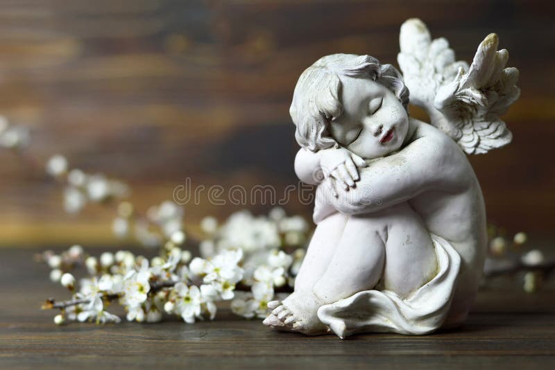Cherub and spring branches stock photo. Image of remembrance - 139005674