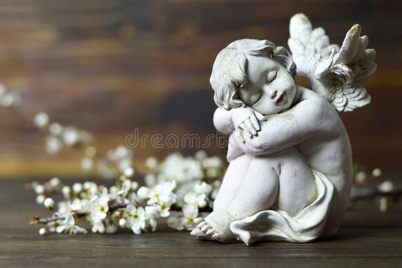 Cherub and spring branches stock photo. Image of remembrance - 139005674