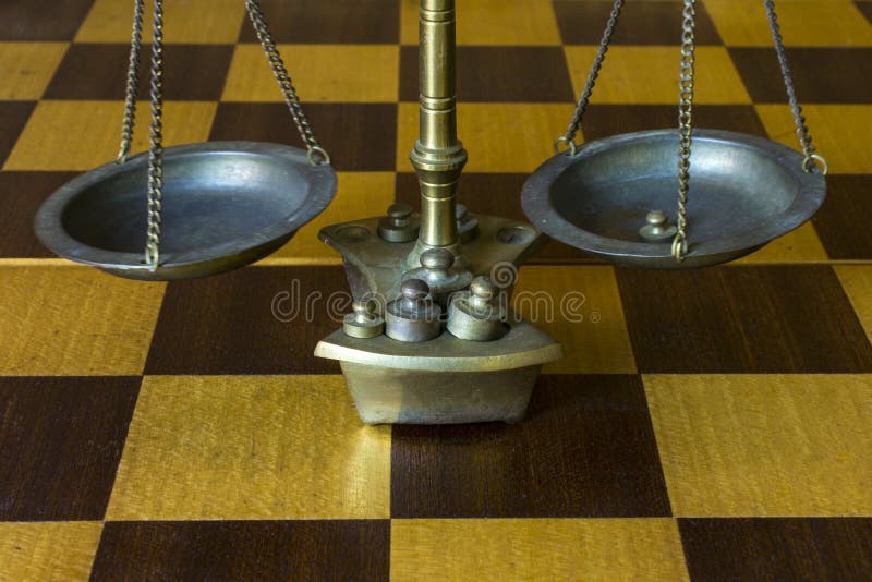 A Chess-board and Bronze Scales As a Background Stock Photo - Image of ...