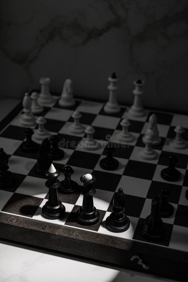 Chess Board with Figures Highlighted by Light Flux Stock Photo - Image ...