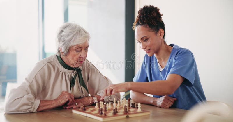 Chess, Elderly Woman and Nurse Playing at Table for Moving, Strategy or ...