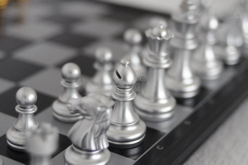 Chess Figure of a Hunter on a Chess Board in Silver Color in Close-up ...