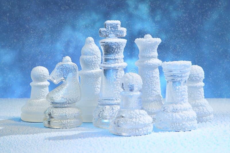 Chess figures under snow stock photo. Image of chance - 17694874