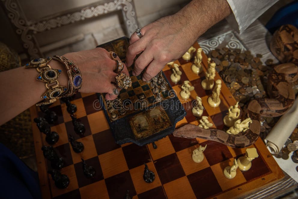 Chess Game Hands with Decorations and a Snake Stock Photo - Image of ...