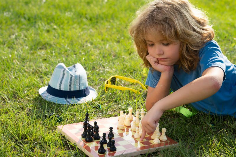 Chess Game for Kids. Child Playing Chess Outdoor in Park. Stock Image ...