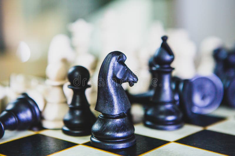 Strategic Chess Game in Progress on a Checkered Board Stock Photo ...
