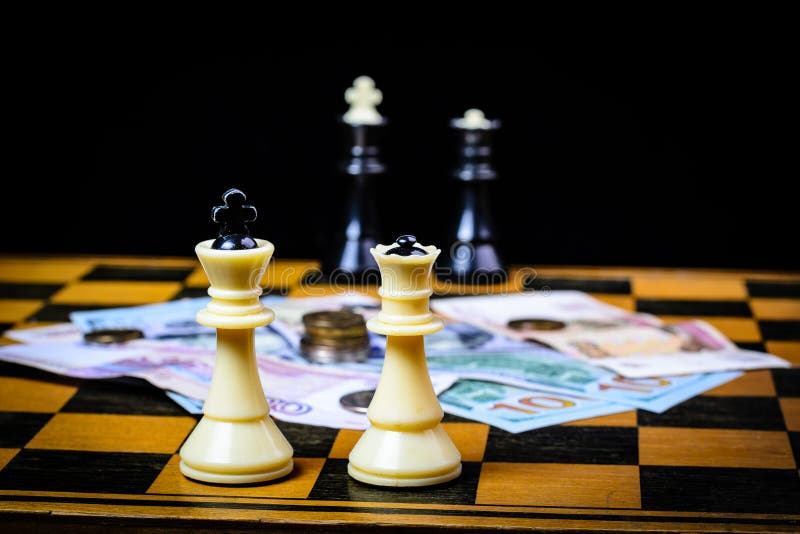 Chess and Money on a Dark Background Stock Photo - Image of ...