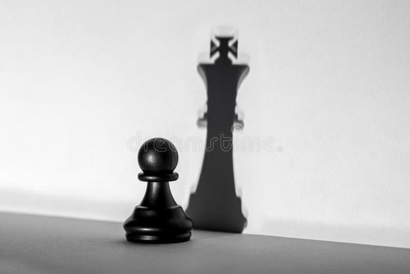 Chess Pawn Standing In A Spotlight Shadow Of King Stock Image - Image ...