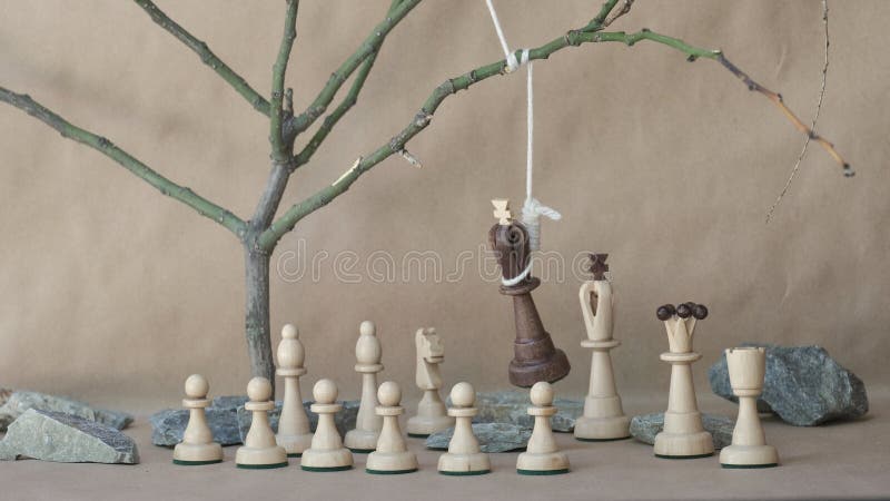 Chess Piece Black King Hanging on Noose among White Chess Pieces Stock ...