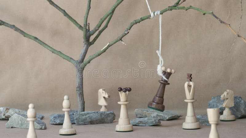 Chess Piece Black Queen Hanging on Noose among White Chess Pieces Stock ...