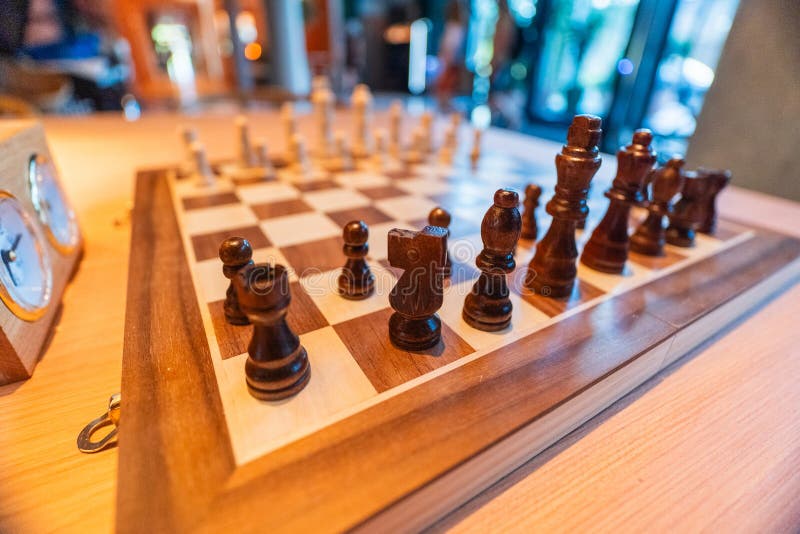 Chess Pieces on a Chess Board with Chess Pieces and a Chess Clock Stock ...