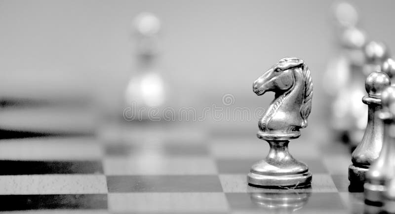 Chess Pieces on Board for Game and Strategy Knight Attacking Stock ...