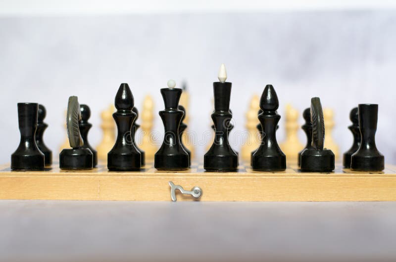 Chess Pieces on a Chessboard Side View. Black Pieces in the Foreground ...