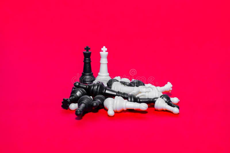 Chess Pieces in a Dramatic Pile Against a Bright Red Background Stock ...