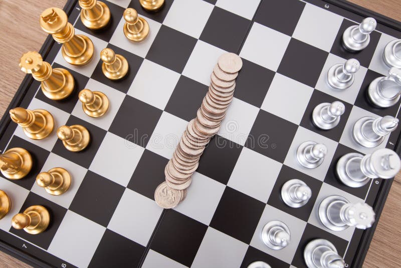 Chess Pieces Placed on the Chessboard and the Dollar Coin in the Middle ...
