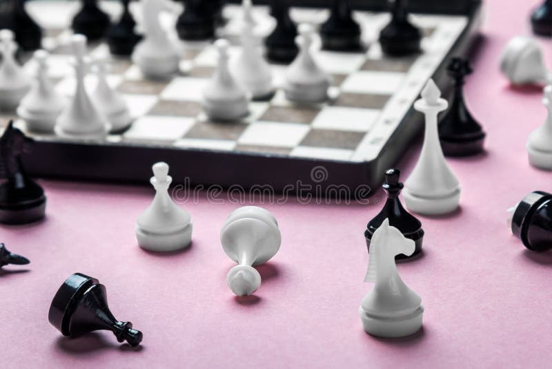 Chess Pieces in a Played Game on a Pink Stock Image - Image of ...