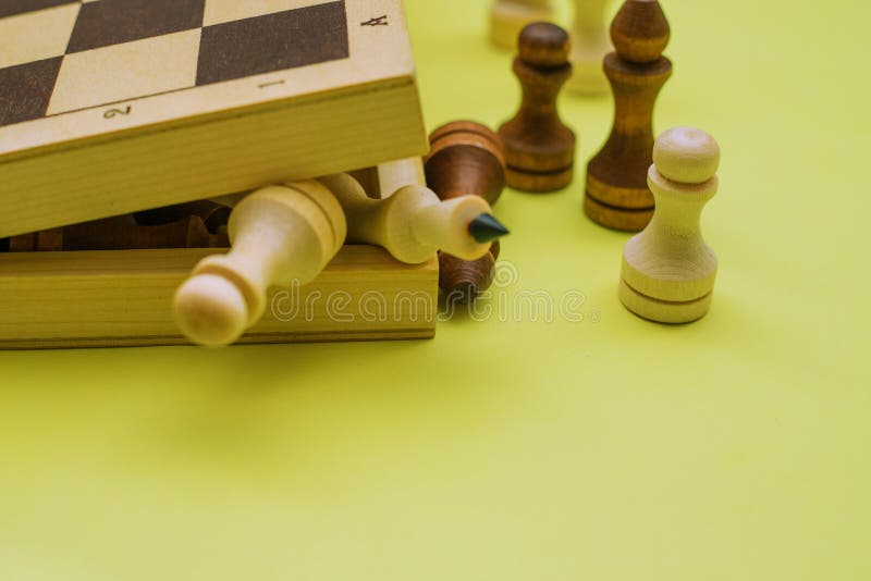 Chess Pieces are Scattered on a Yellow Background. Black and White ...