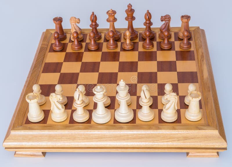Chess Pieces in Starting Position on a Wooden Board Stock Image - Image ...