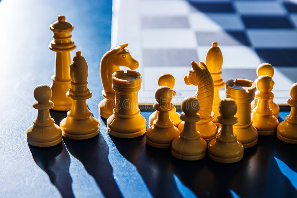 Chess Pieces in Sunlight on a Blue Tournament Table after the Endgame ...