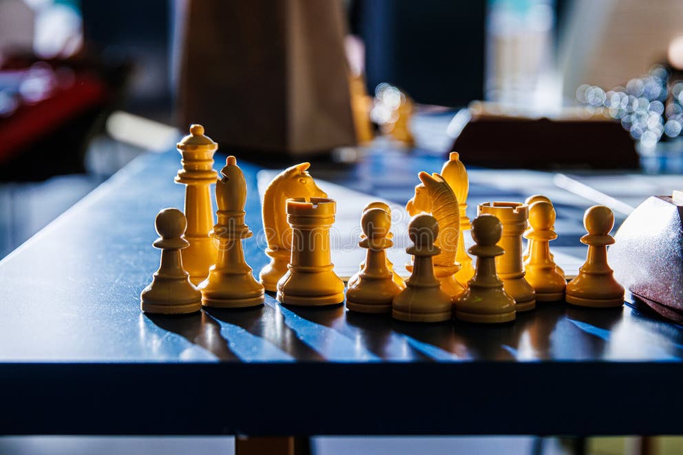 Chess Pieces in Sunlight on a Blue Tournament Table after the Endgame ...