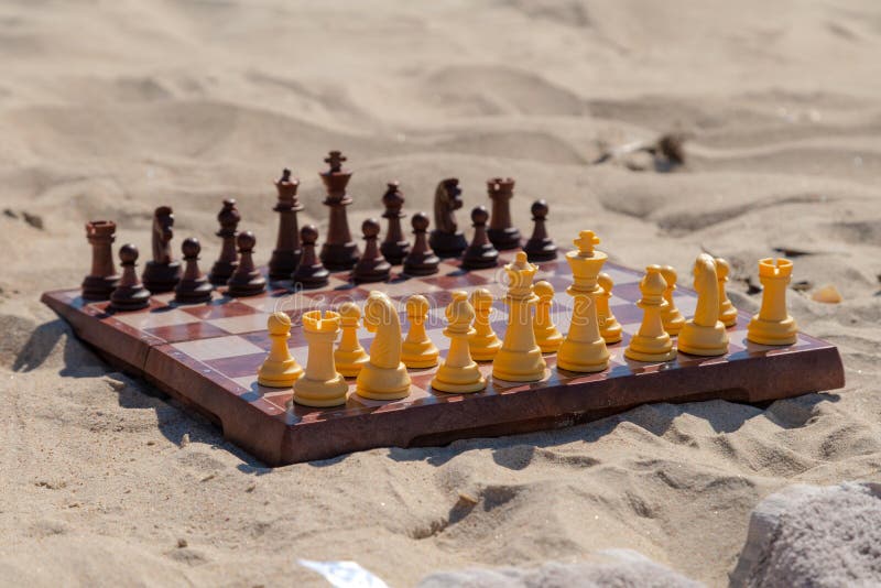 Chess Play on the Board at the Beach. Chessboard on the Sand on a Sunny ...
