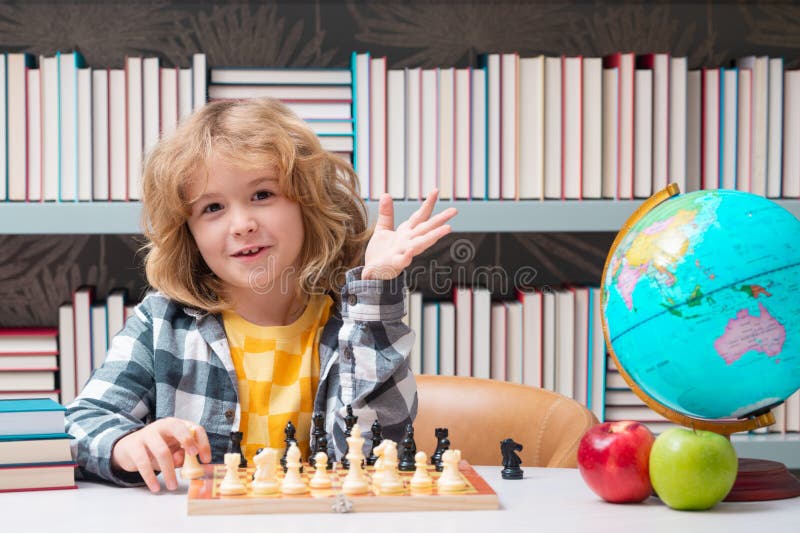 Chess School. Concentrated Child Play Chess. Kid Playing Board Game in ...