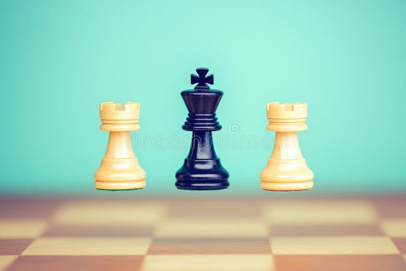 Chess Strategy Concept with Black King and White Rooks on Chessboard ...