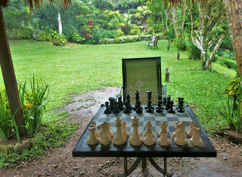 Chess Table by the Garden stock image. Image of game - 97260627