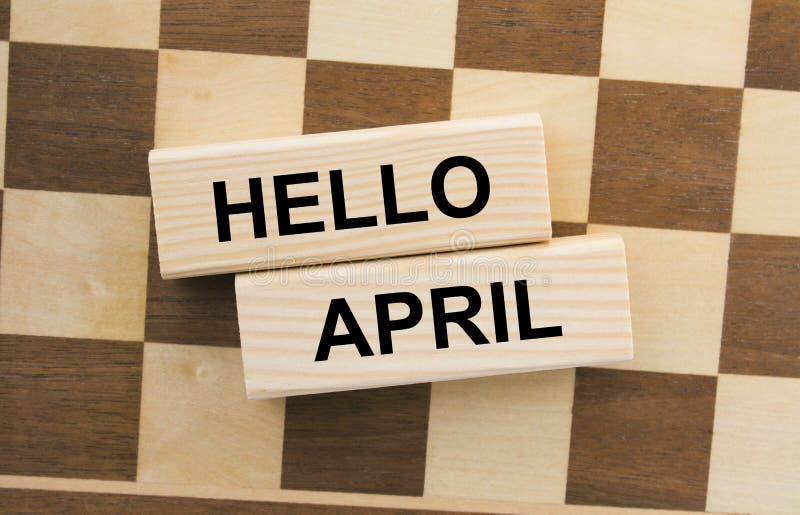 Chessboard with Wooden Blocks with Text Hello April Stock Photo - Image ...