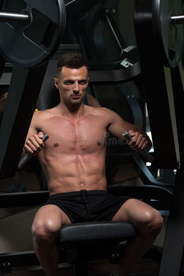 Chest Exercise on Machine stock image. Image of exercise - 69234837