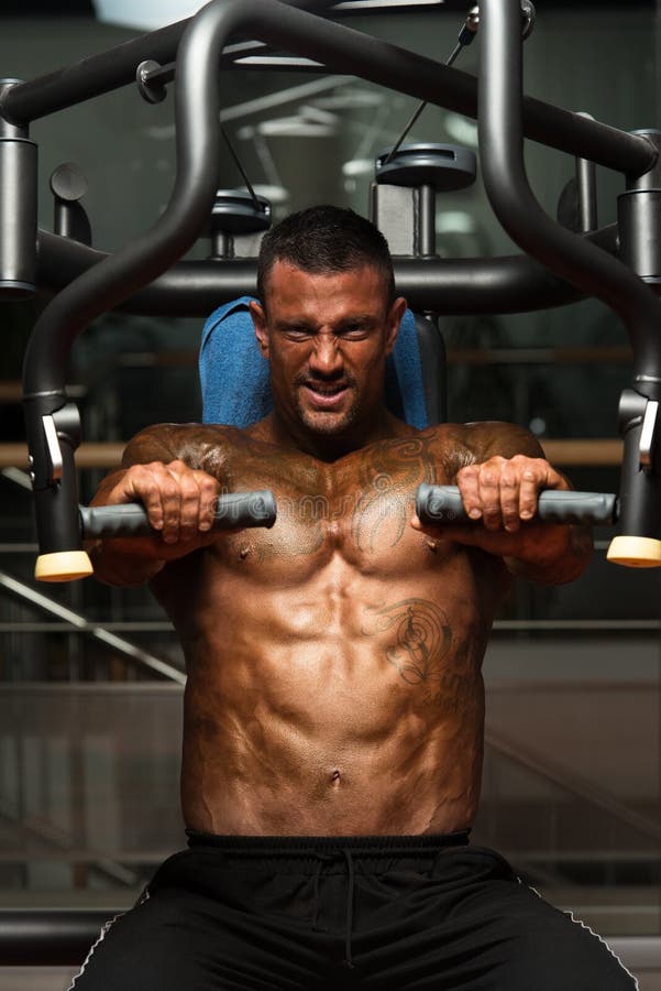 Chest Exercises on a Machine Stock Image - Image of abdominal, machine ...