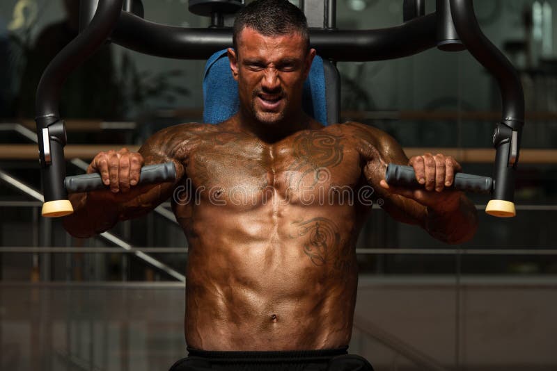Chest Exercises on a Machine Stock Image - Image of picking, athlete ...