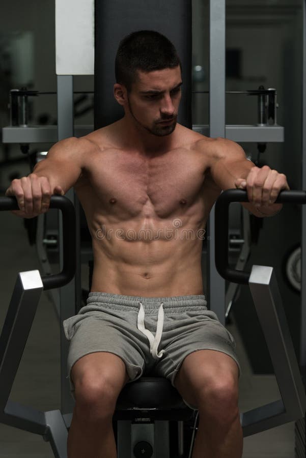 Chest Exercises on a Machine Stock Image - Image of chest, handsome ...