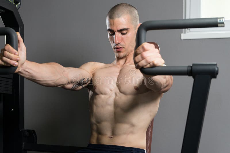 Chest Exercises on a Machine Stock Image - Image of exercise ...