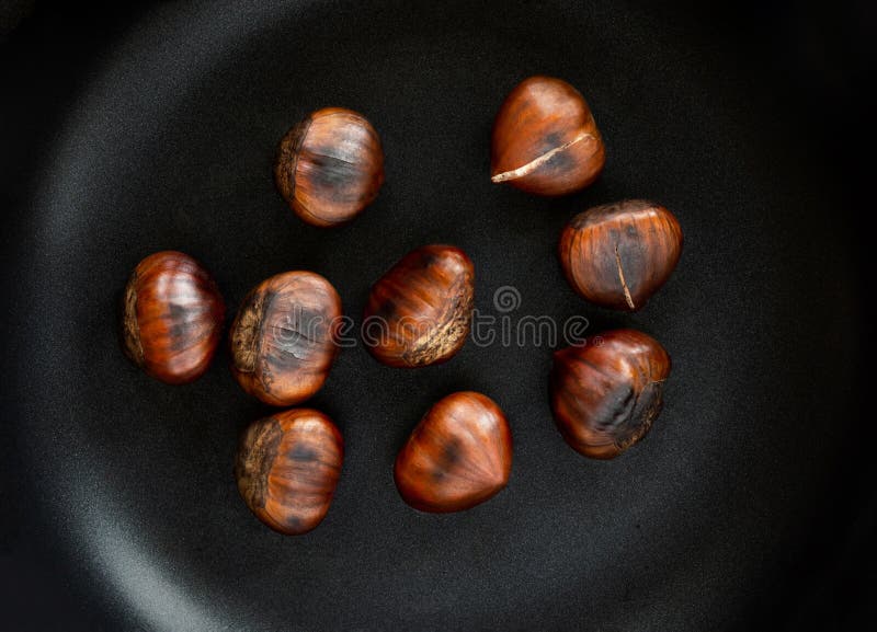 Chestnut on a Black Frying Pan, Top View. Roasted Chestnuts Close Up ...