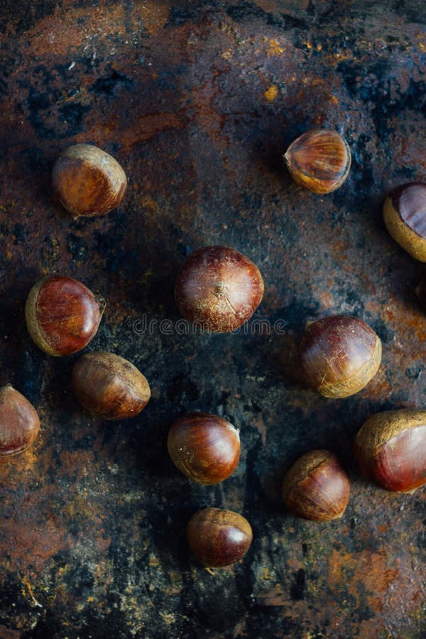 Chestnuts on black stock photo. Image of natural, table - 87451372