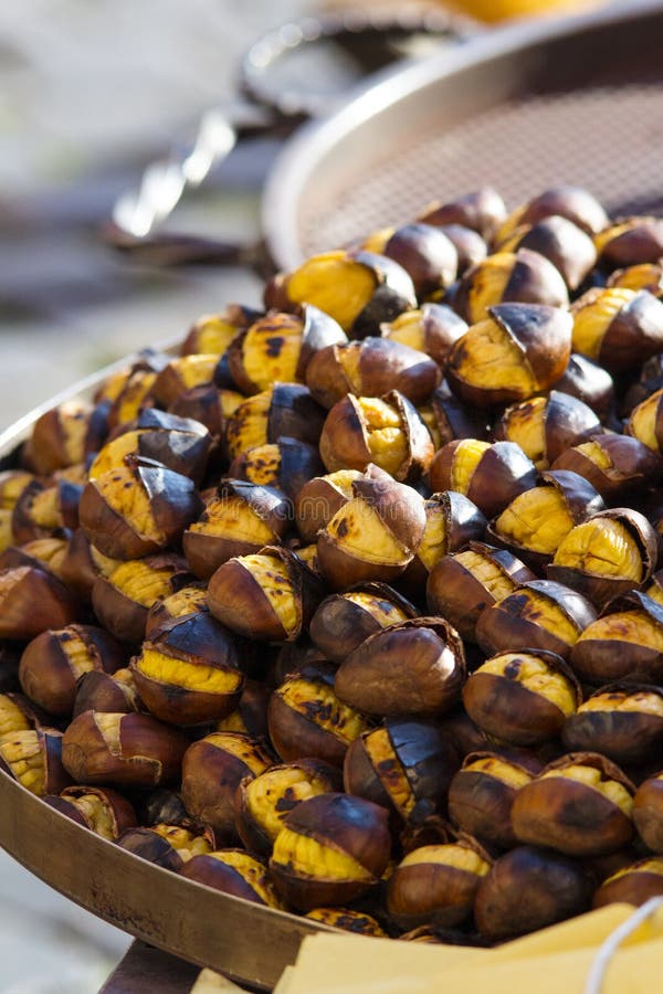 Roasting Chestnuts On The Grill By A Street Vendor In Rome, Stock Image ...
