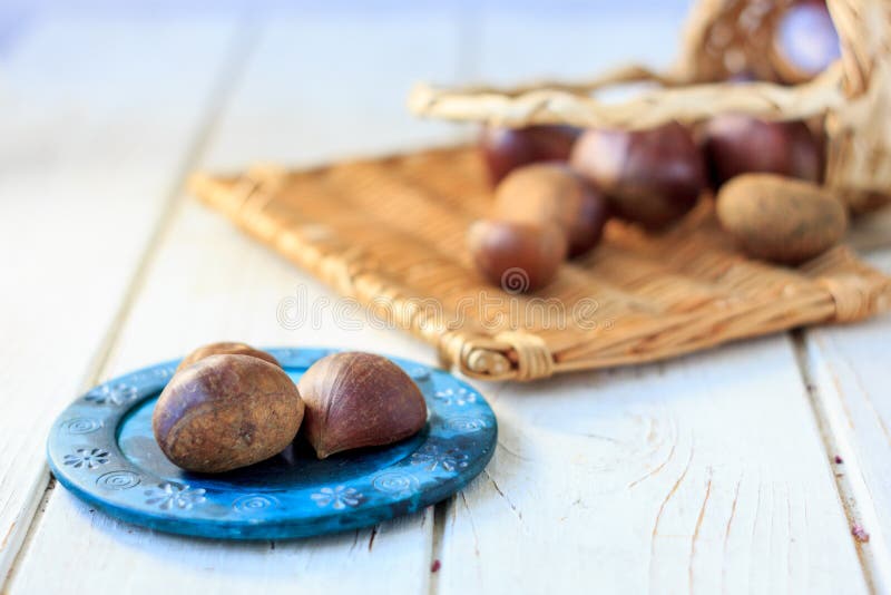 Chestnuts on plate stock image. Image of chestnut, blue - 89378841