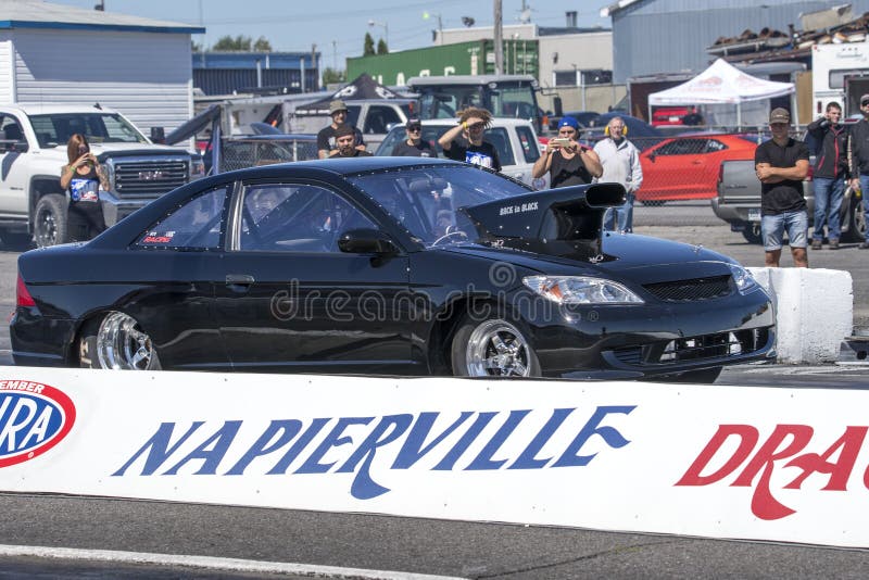 Chevrolet Cavalier Making a Wheelie on the Track at the Starting Line ...