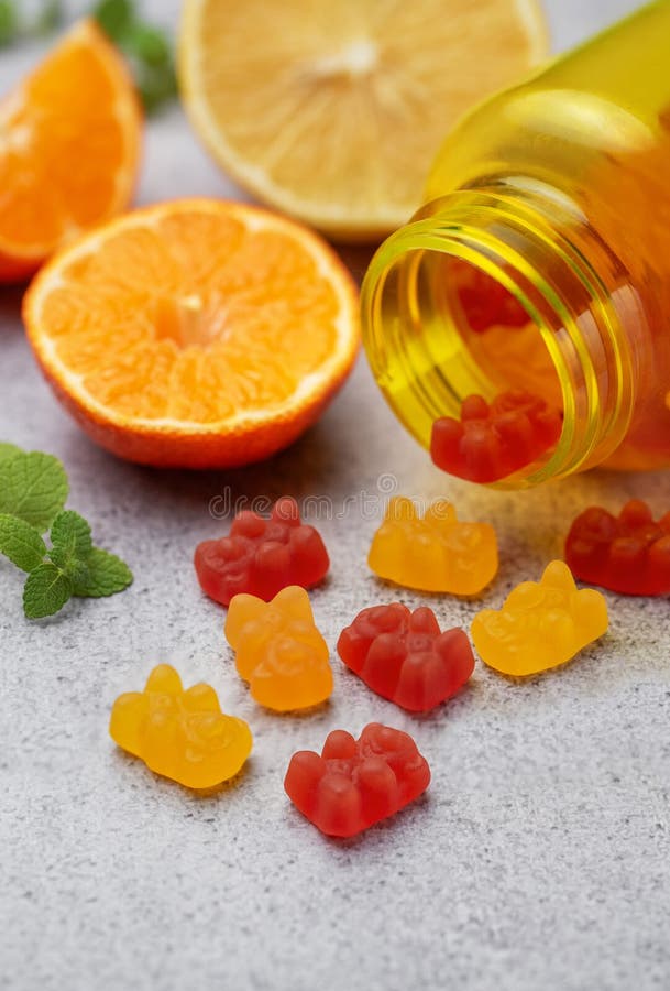 Chewable Gummy Vitamins and Fresh Oranges Stock Photo - Image of ...