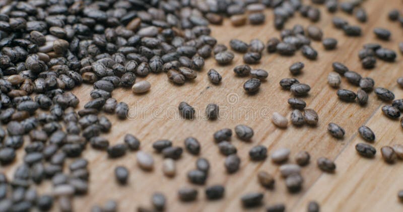 Chia Seed Falling and Rotating Macro Studio Stock Footage - Video of ...