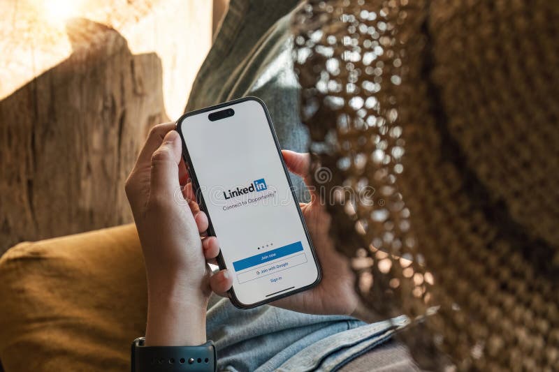 CHIANG MAI, THAILAND - DEC 4, 2023: Woman Using IPhone 14 with LinkedIn ...
