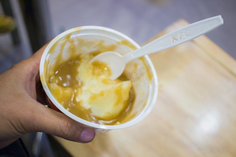 CHIANGMAI,THAILAND-MAY 3,2019 : . Man Hand Holding Mashed Potatoes Cup ...