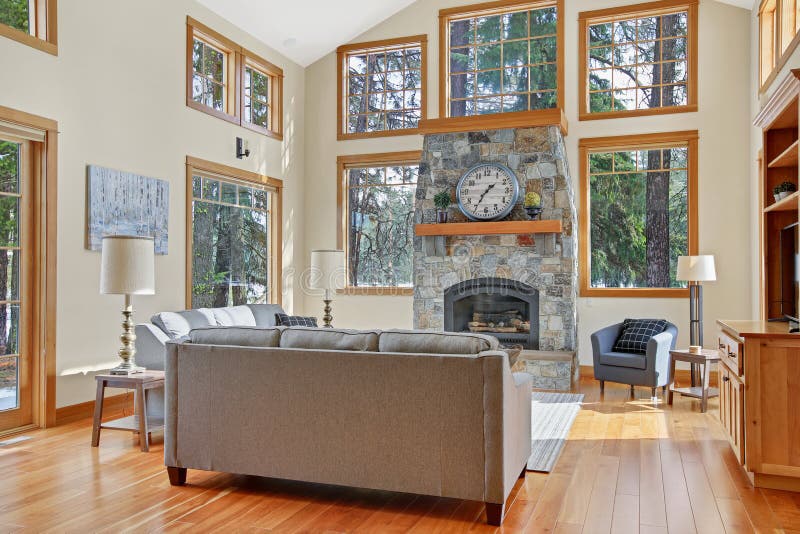 Chic Living Space with High Vaulted Ceiling and Stone Fireplace. Stock ...