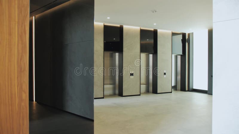 A Modern Elevator Lobby Featuring a Stylish Interior Design that ...
