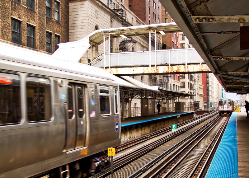 Orange Line Elevated "el" Train Entering Station in Foreground, while ...