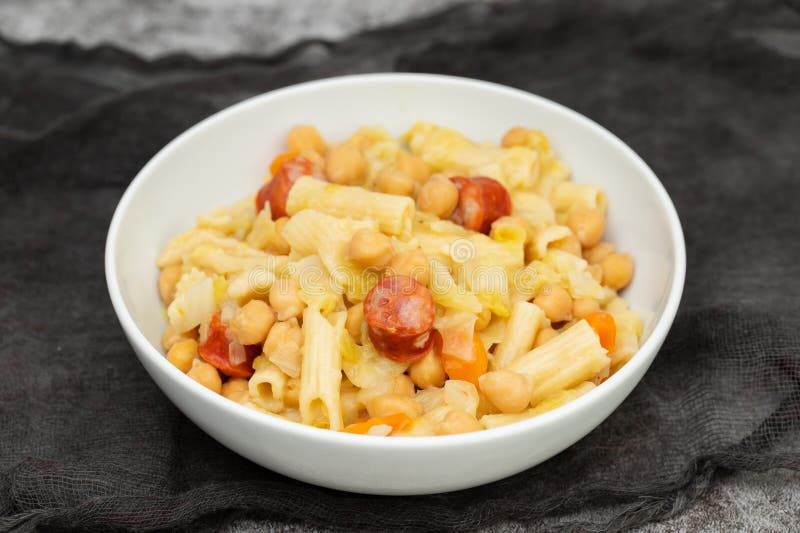 Chick Pea with Smoked Sausages, Pasta and Cabbage in White Bowl Stock ...