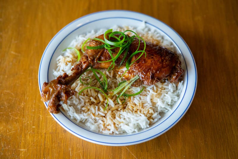 Chicken Adobo with Rice stock photo. Image of plate - 236791838