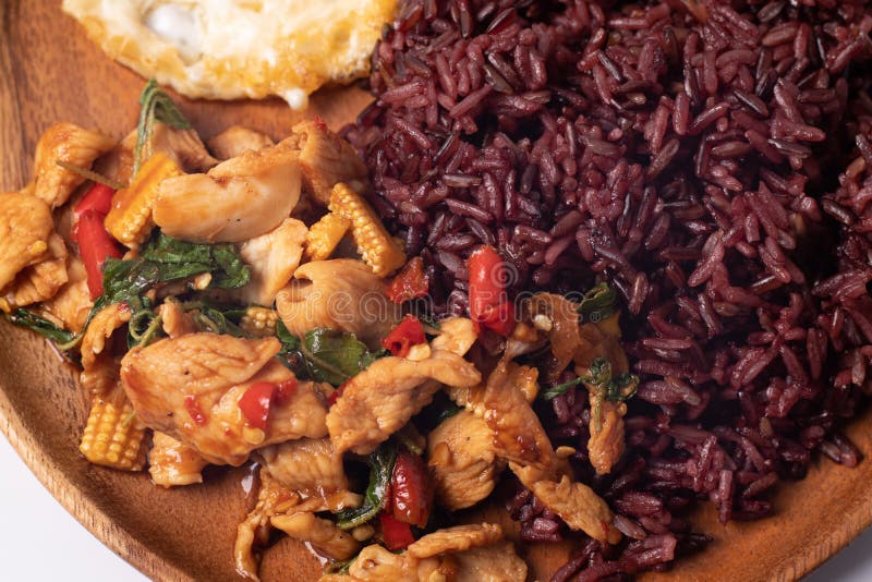 Chicken Basil with Fried Egg and Riceberry Rice Stock Photo - Image of ...